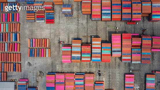 warehouse stacking containers Group of objects rooftop in a row and forklift handing load ...