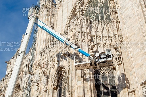Technicians on lifting platform for scheduled maintenance plan and study of the degradation ...
