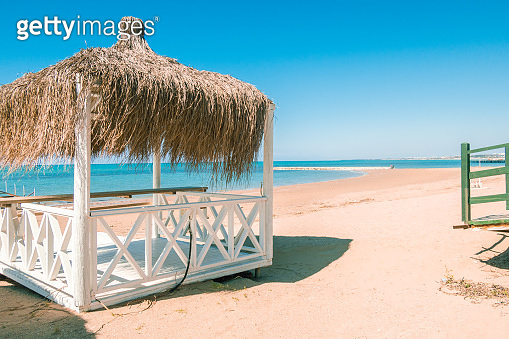 Massage Huts With Thatched Roof On Sand Beach Along Seaside Luxury