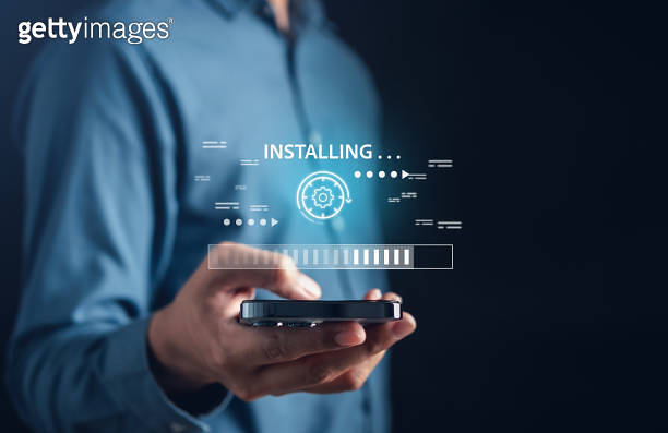 Update software system in computer. Man using smartphone upgrade program, Business technology ...