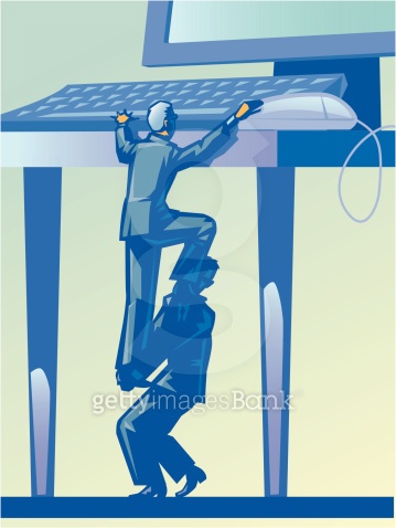 Two miniature businessmen helping one another reach a computer mouse on ...