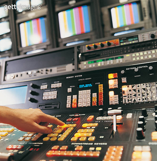 Person Pressing Buttons on a TV Studio Control Panel 이미지 (dv1396026 ...