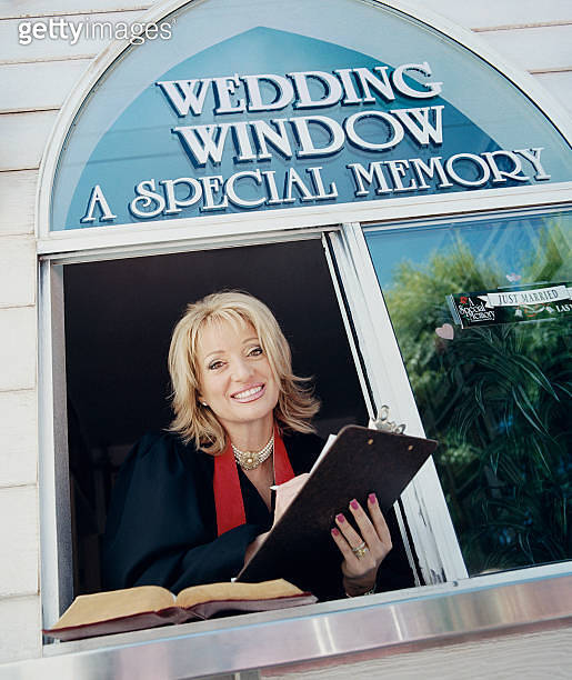 Female Priest Looking Out of the Window at a Drive-In Church in Las ...