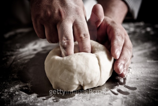 Vignette of baker poking ball of raw dough 이미지 (87542975) - 게티이미지뱅크