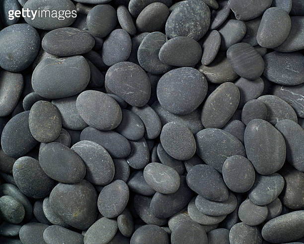 Close-up view of Black river rock stones for textured background 이미지 ...