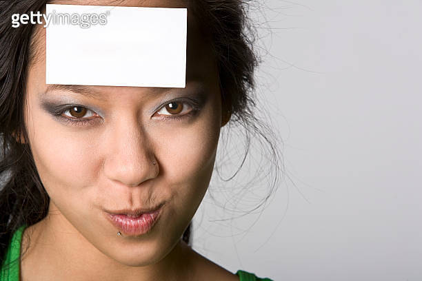 Vietnamese Woman with Business Card on Forehead 이미지 (117963588) - 게티이미지뱅크
