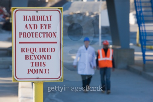 Warning sign saying 'Hardhat and Eye Protection Required Beyond This ...