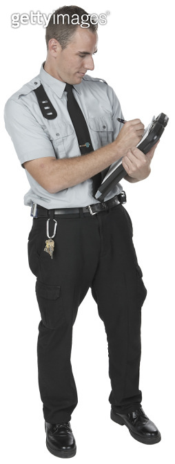 Security Guard Writing on Clipboard (92821144) - 게티이미지뱅크