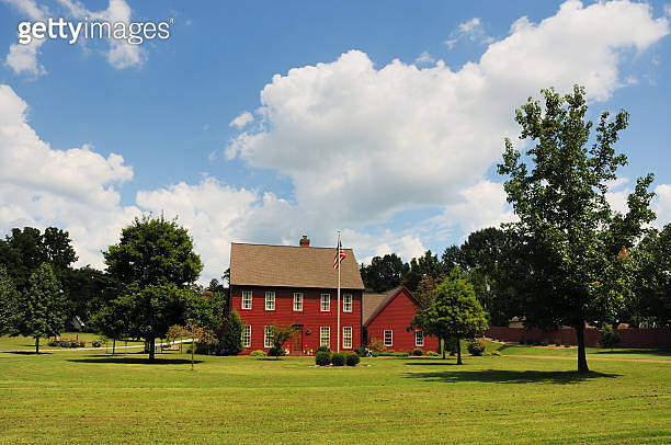New Old Style Farmhouse with Red Siding and American Flag 이미지 ...