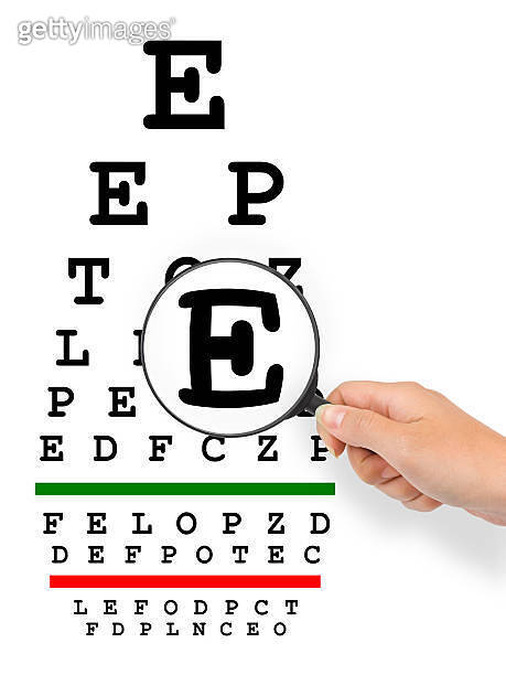 Hand with magnifier and eyesight test chart 이미지 (97759695) - 게티이미지뱅크