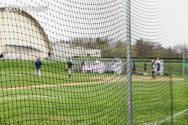 Baseball Players Behind Safety Net at High School Sports Game 이미지 ...