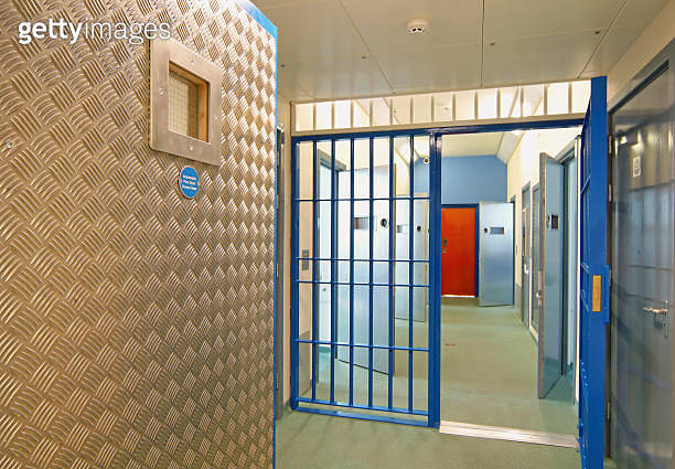 Interior view of a modern prison with open doors (174778255) - 게티이미지뱅크