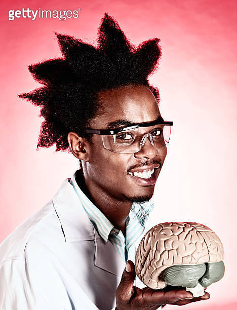 Smiling young scientific nerd with Afro holds up model brain (175391651 ...