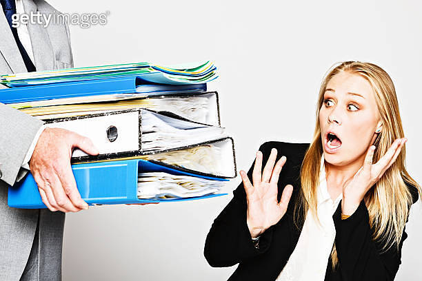 Young businesswoman is alarmed by huge stack of work arriving 이미지 ...