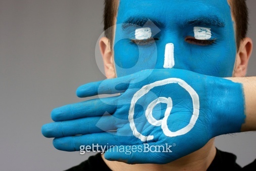 Painted blue face with Screaming emoticon drawn on his hand (177506678 ...