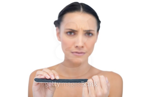 Frowning model with nail file 이미지 (180405519) - 게티이미지뱅크