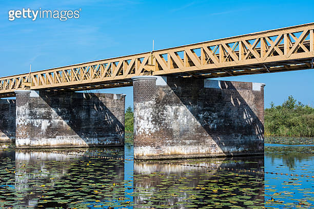 Restored Railway bridge side view with water reflection (187251980 ...