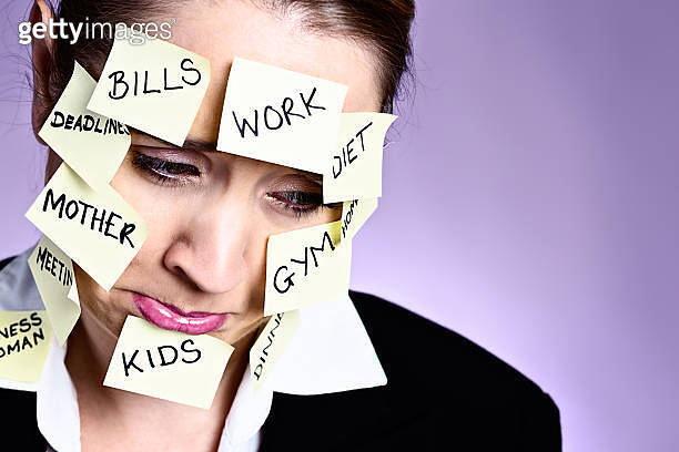 Unhappy, pouting woman covered in job reminders hates multitasking ...