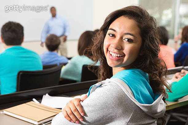 College or high school girl looking back during class 이미지 (174870813 ...