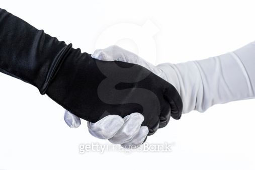 Theatrical costumed handshake (490065783) - 게티이미지뱅크