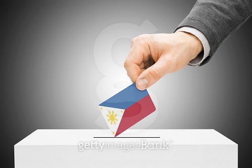 Male inserting flag into ballot box - Philippines 이미지 (524818265) - 게티이미지뱅크