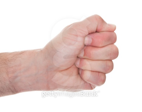 Close-up Man's Hand Clenching His Fist (468666613) - 게티이미지뱅크