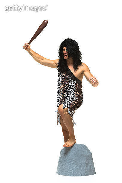 Caveman on rock holding club 이미지 (516042145) - 게티이미지뱅크
