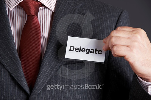 Businessman Attaching Delegate Badge To Jacket 이미지 (519619221) - 게티이미지뱅크