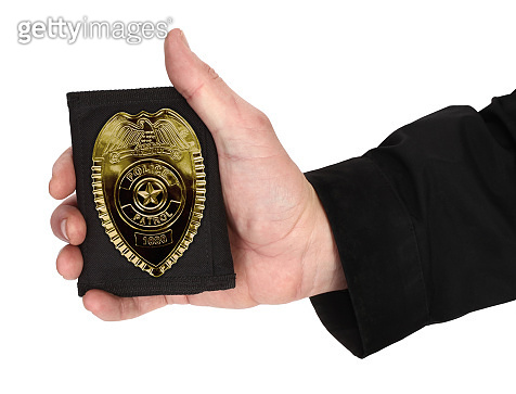 Man hand is holding police badge 이미지 (526247811) - 게티이미지뱅크