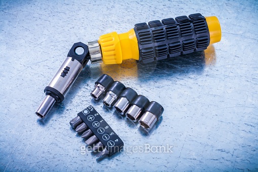 Reversible screwdriver screw bits and torxes on metallic backgro 이미지 ...