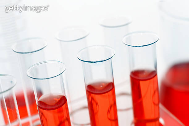 Science research laboratory, test tubes with red liquid, white ...