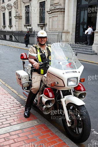 Peruvian motorcycle policeman on duty in Lima city centre (471571109 ...