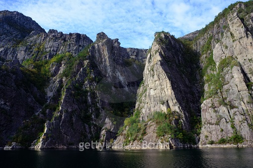 triangular shaped rock in water 이미지 (497835386) - 게티이미지뱅크