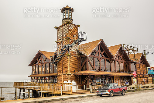 Old Restaurant with a historic lighthouse in Cedar Key, Florida ...