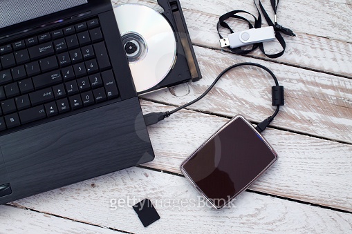 Laptop with pendrive, sd card, CD and portable hard drive. (496163378 ...