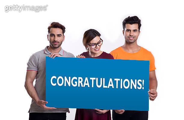 Group of young people showing placard of congratulation 이미지 (531045176 ...