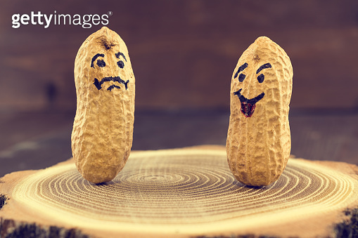 Smile and sad face drawn on dried peanuts (615418128) - 게티이미지뱅크
