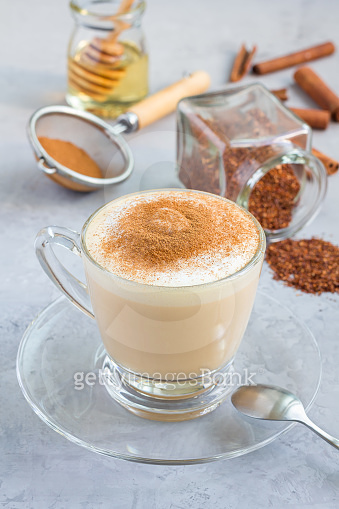 Healthy rooibos red tea latte topped with cinnamon, vertical 이미지 ...