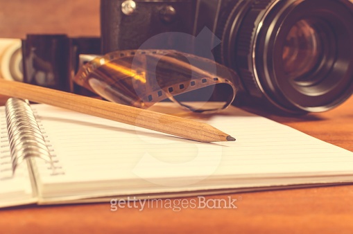 SLR camera on the table next to negative film strip 이미지 (504036510 ...