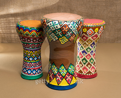 Three decorated colorful pottery goblet drums (chalice drum, tarabuka ...