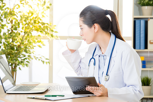 doctor drink coffee using digital tablet research patient's medical 이미지 ...