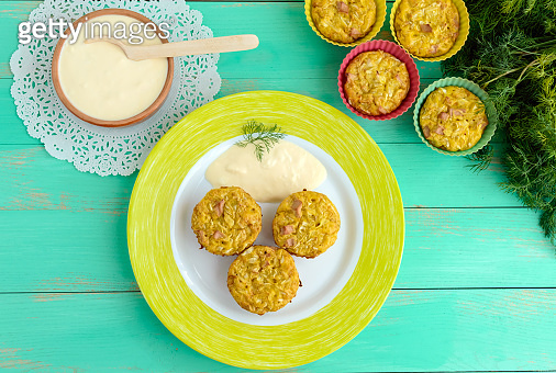 Muffins from cabbage with ham and cheese. Sour cream sauce. (622077752 ...
