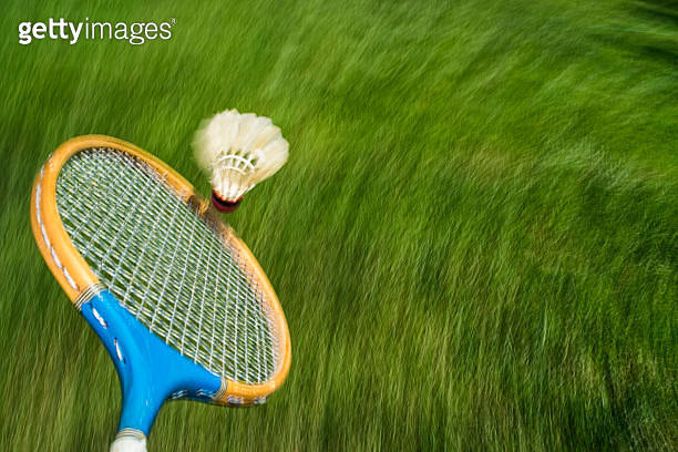 Vintage badminton racket hitting a shuttlecock in mid-air 이미지 ...