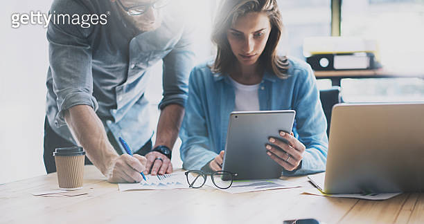 Coworking team brainstorming process in modern loft.Project manager ...