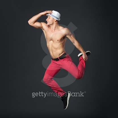 Young happy male dancer jumping in studio. 이미지 (503869648) - 게티이미지뱅크