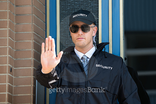 Male Security Guard Making Stop Sign With Hand 이미지 (625871986) - 게티이미지뱅크