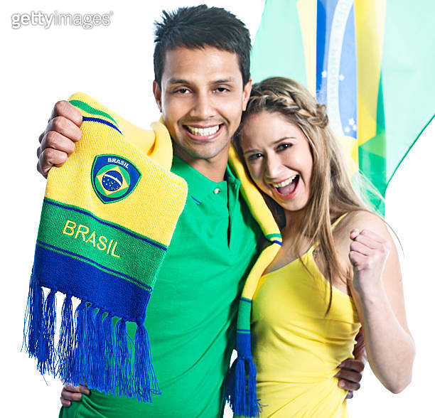 Young Brazilian sports fan couple encouraging their team (612501562 ...
