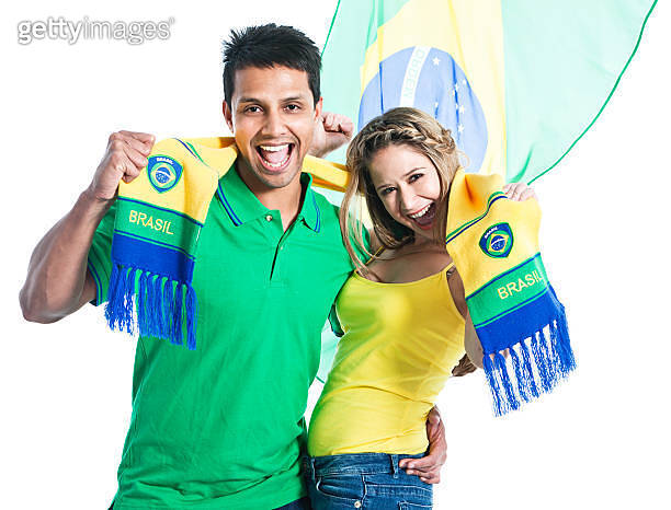 Brazilian sports fan couple cheer their team on excitedly (612246890 ...