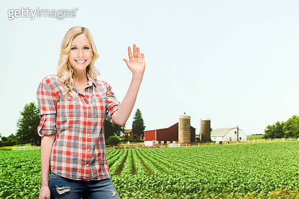 Smiling farmer in farm and waving hand 이미지 (516416314) - 게티이미지뱅크