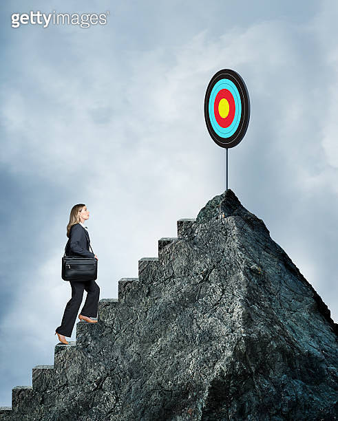 Businesswoman Climbing Steps To Reach Her Goal 이미지 (610051386) - 게티이미지뱅크